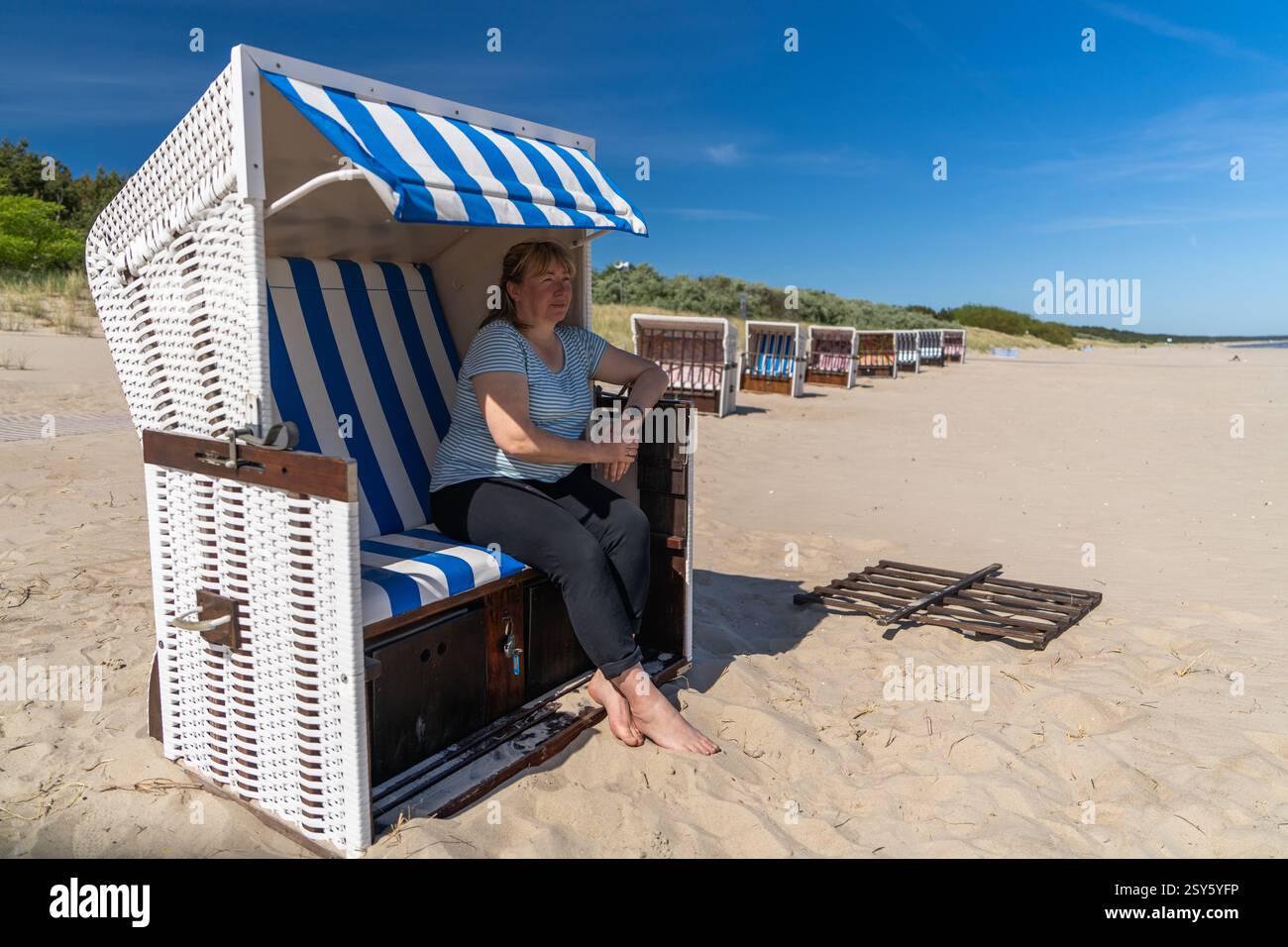 Summer holidays on the Baltic Sea. Woman of European beauty in white ...
