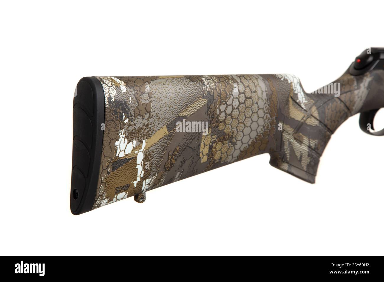 Stock of a rifle with a camouflage pattern, featuring a mix of brown ...