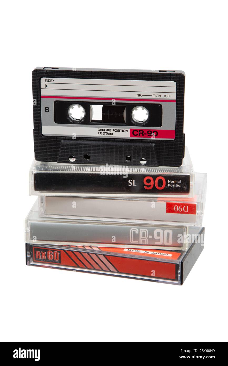 Stack of vintage audio cassettes, black and silver, in clear cases ...