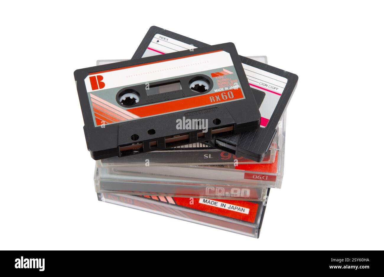 Pile of retro audio cassettes, black and red, housed in transparent ...