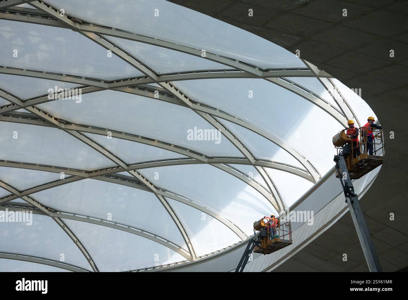 Beijing, China. 26th Feb, 2025. Workers are pictured at the ...