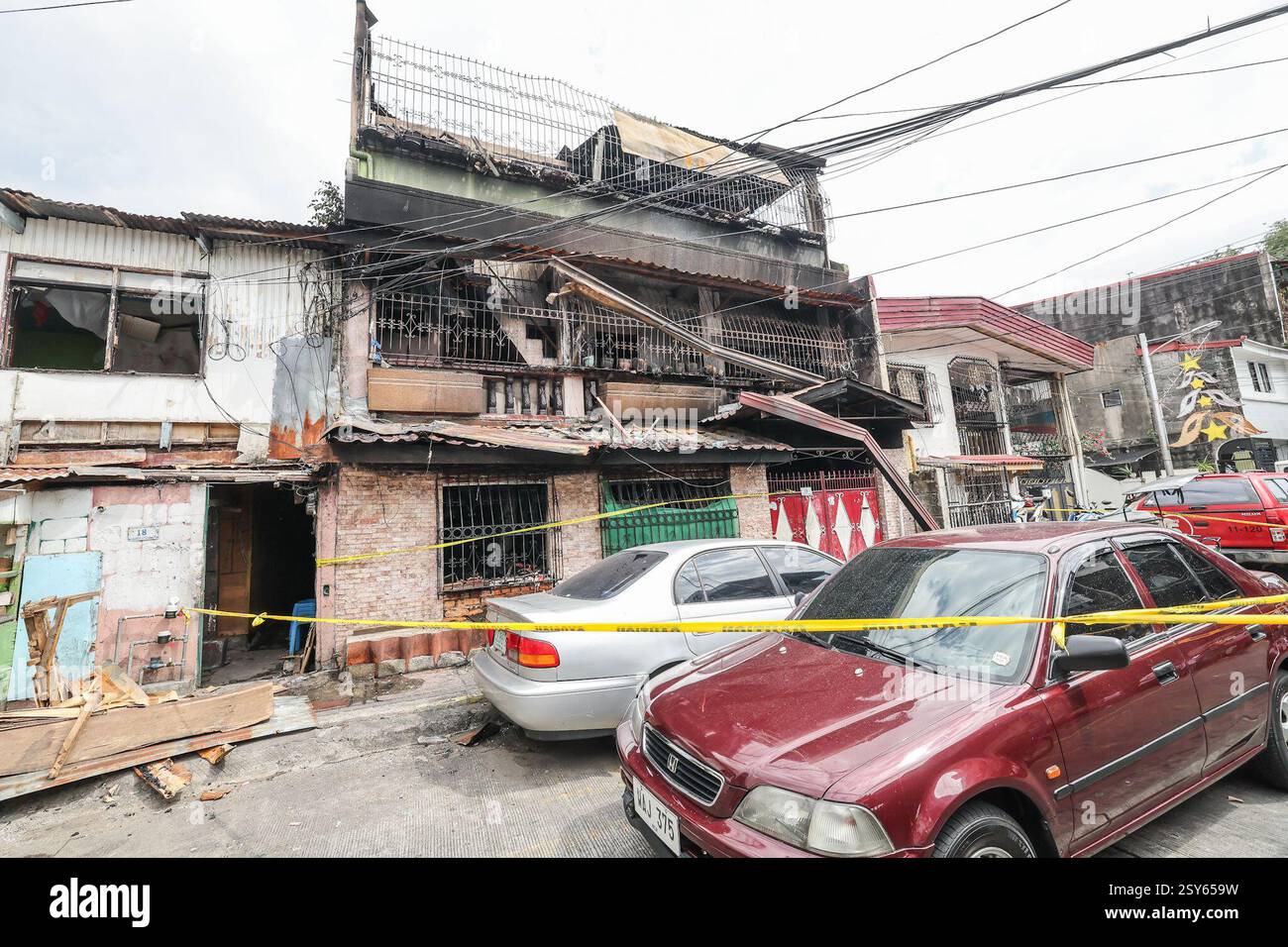 Manila, Philippines. 27th Feb, 2025. A charred house is seen after a ...