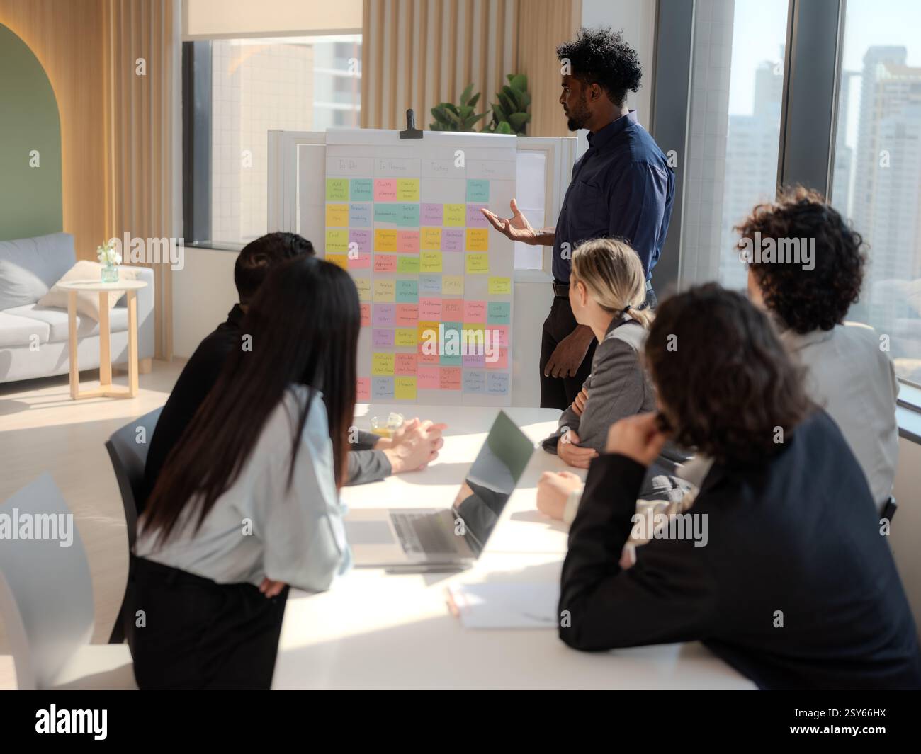 A diverse group of professionals collaborating and brainstorming on a ...