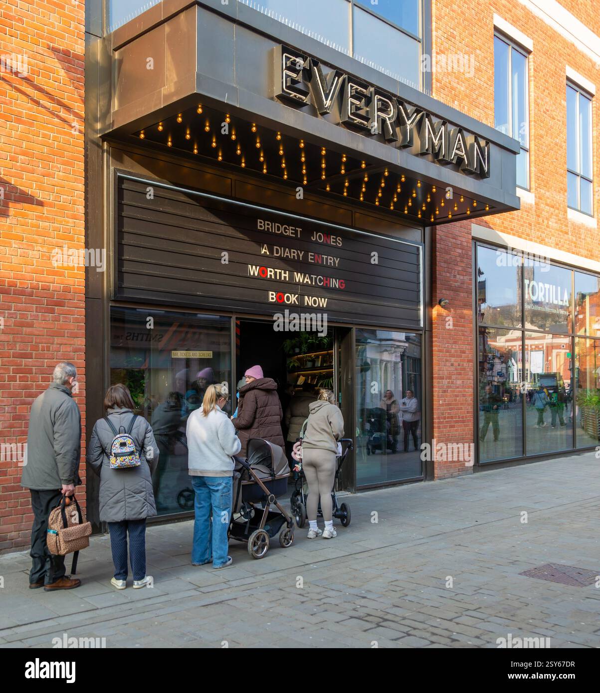 People queuing outside Everyman Cinema, Cornhill Quarter shopping area in city centre, Lincoln ...