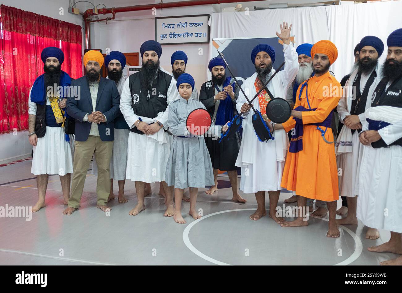 Before the simulated sword fight using wooden sabres, a priest belsses ...
