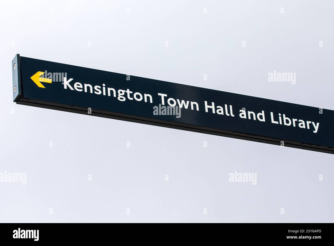A direction sign for Kensington Town Hall and Library in London, UK ...