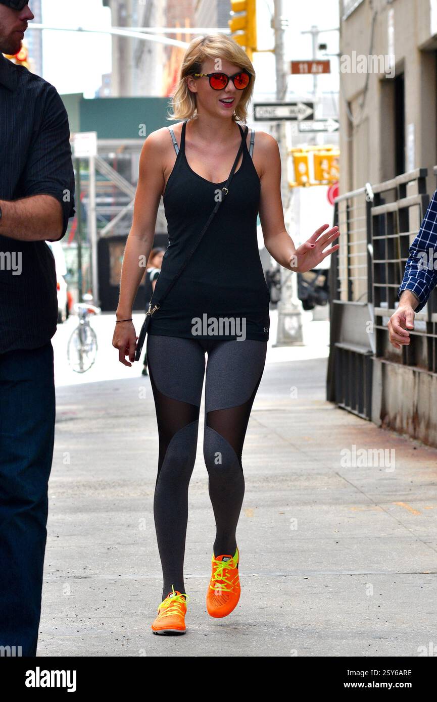 Singer Taylor Swift wears yoga pants and a tank top as she leaves a gym ...