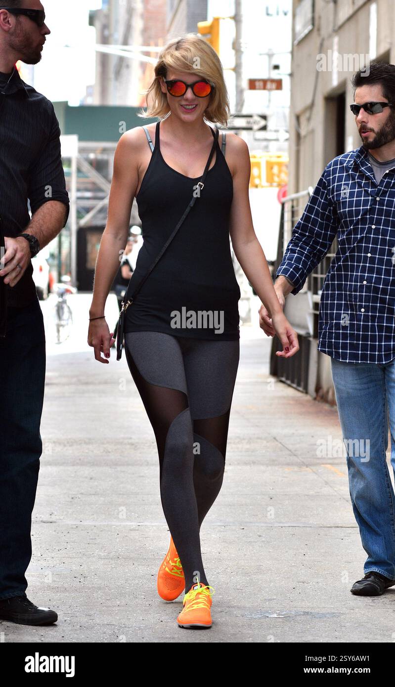 Singer Taylor Swift wears yoga pants and a tank top as she leaves a gym ...