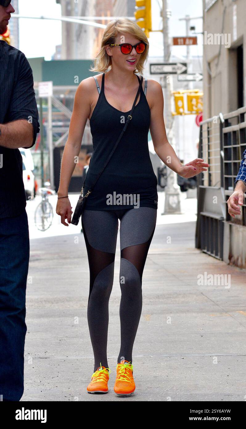 Singer Taylor Swift wears yoga pants and a tank top as she leaves a gym ...
