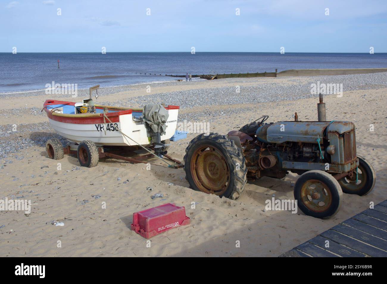 Old tractor and fishing boat on the beach at Cromer, Norfolk, UK Stock ...