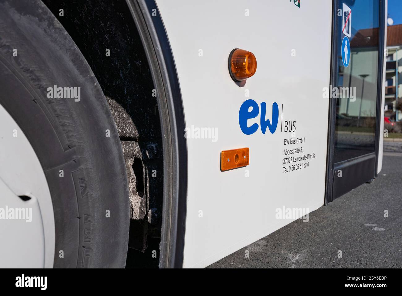 EW bus logo next to the front door of a public bus Stock Photo - Alamy
