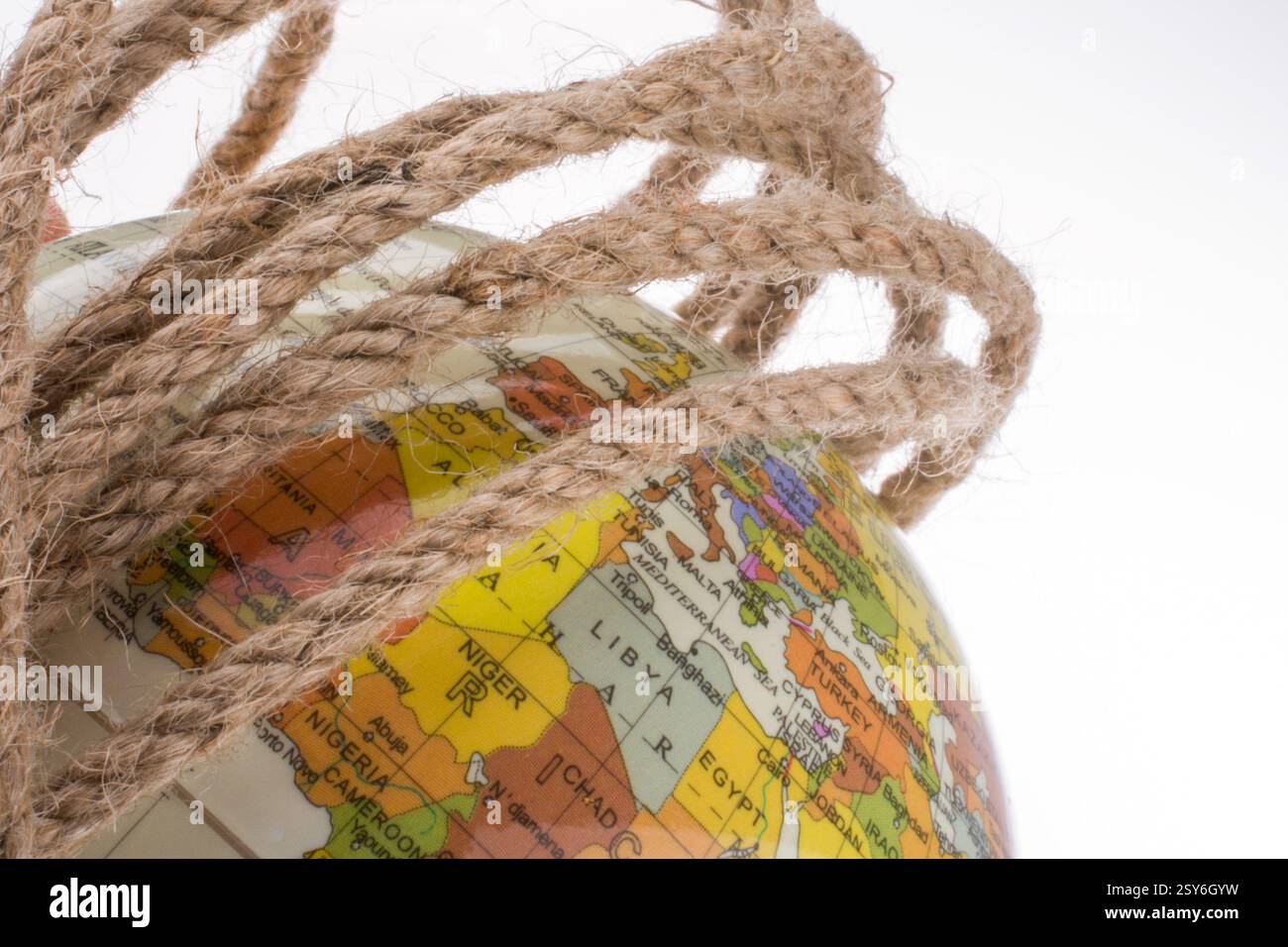 hands holding the globe wrapped in rope Stock Photo - Alamy