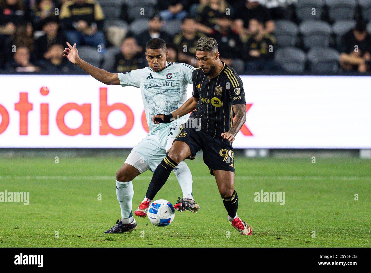LAFC forward Denis Bouanga (99) is defended by Colorado Rapids forward ...