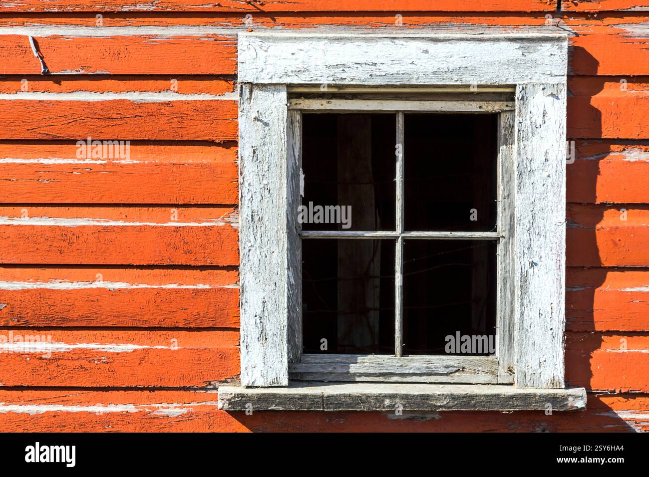 Window with a white frame and a wooden sill. The window is open and the ...