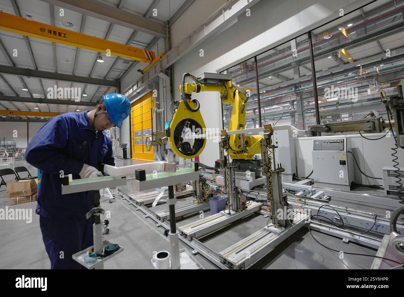 HARBIN, Feb. 27, 2025 -- A staff member operates with smart equipment ...
