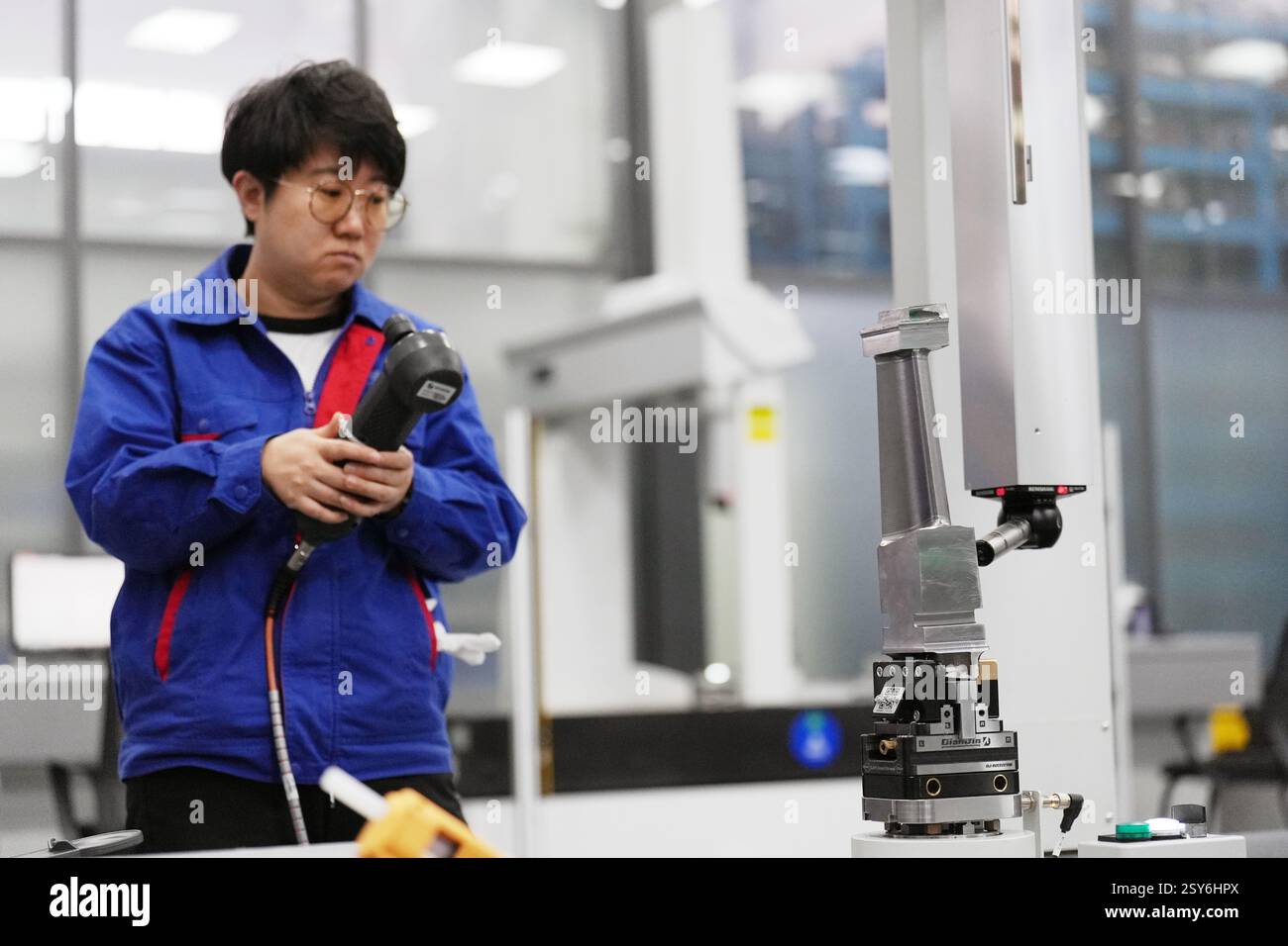 HARBIN, Feb. 27, 2025 -- A quality control engineer checks a component ...