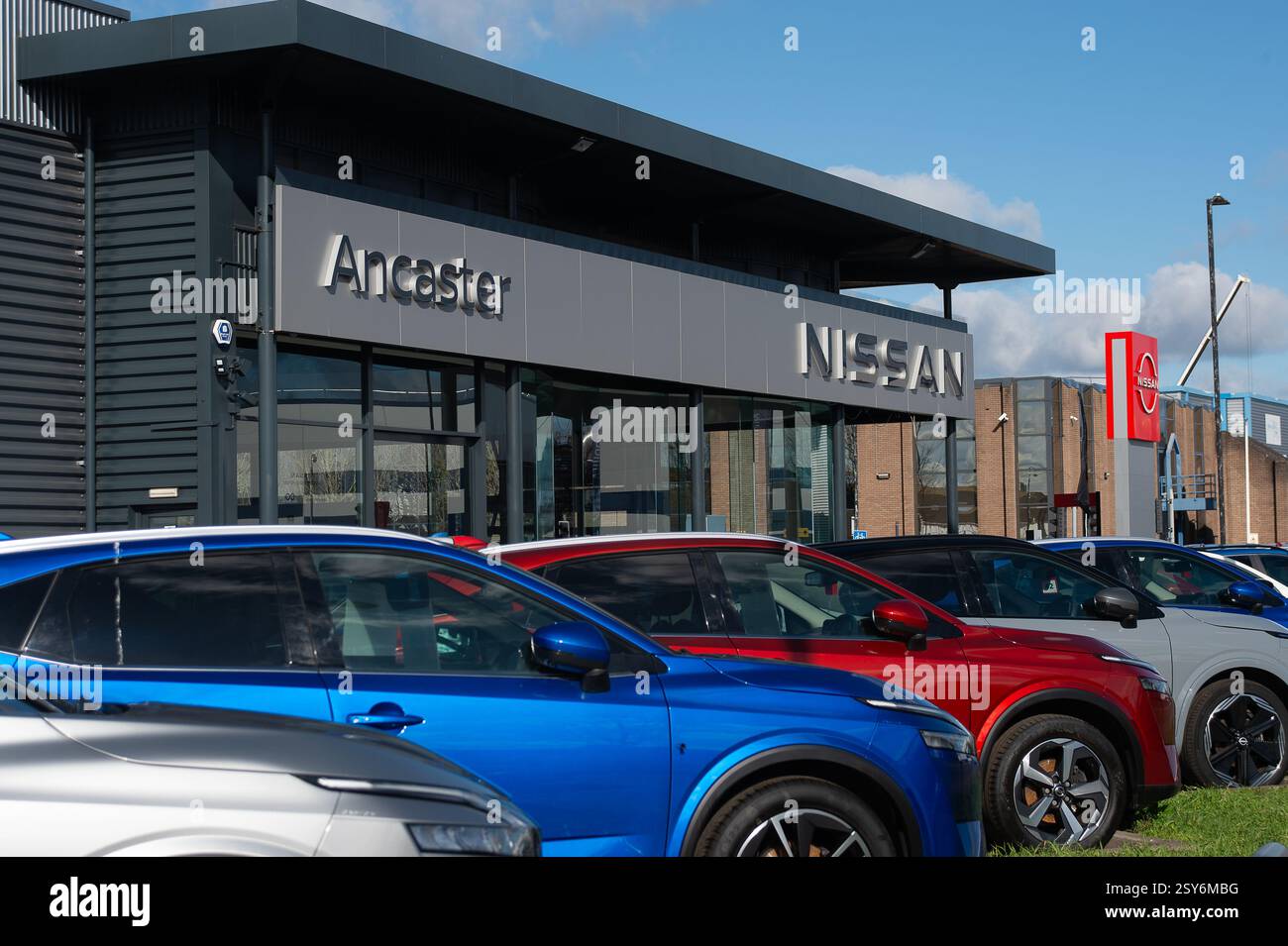 Slough, UK. 27th February, 2025.A Nissan dealership and car showroom in ...