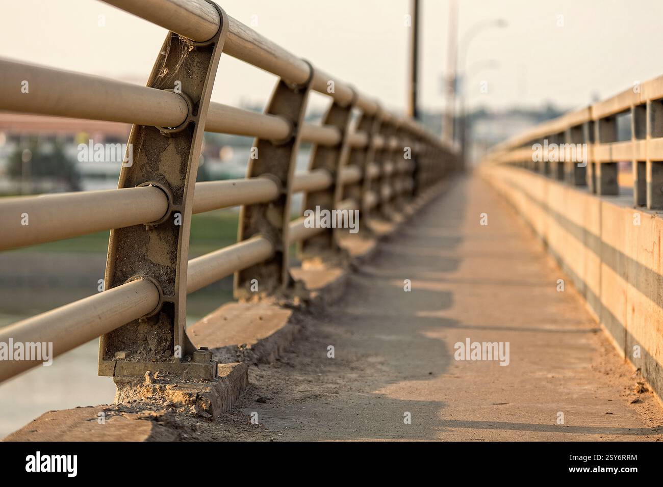 Bridge with a railing on the side. The railing is made of metal Stock ...