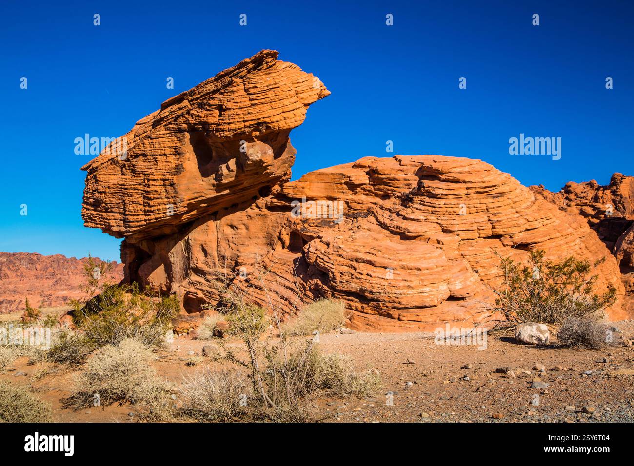 Large rock formation with a small rock sticking out of it. The rock is ...