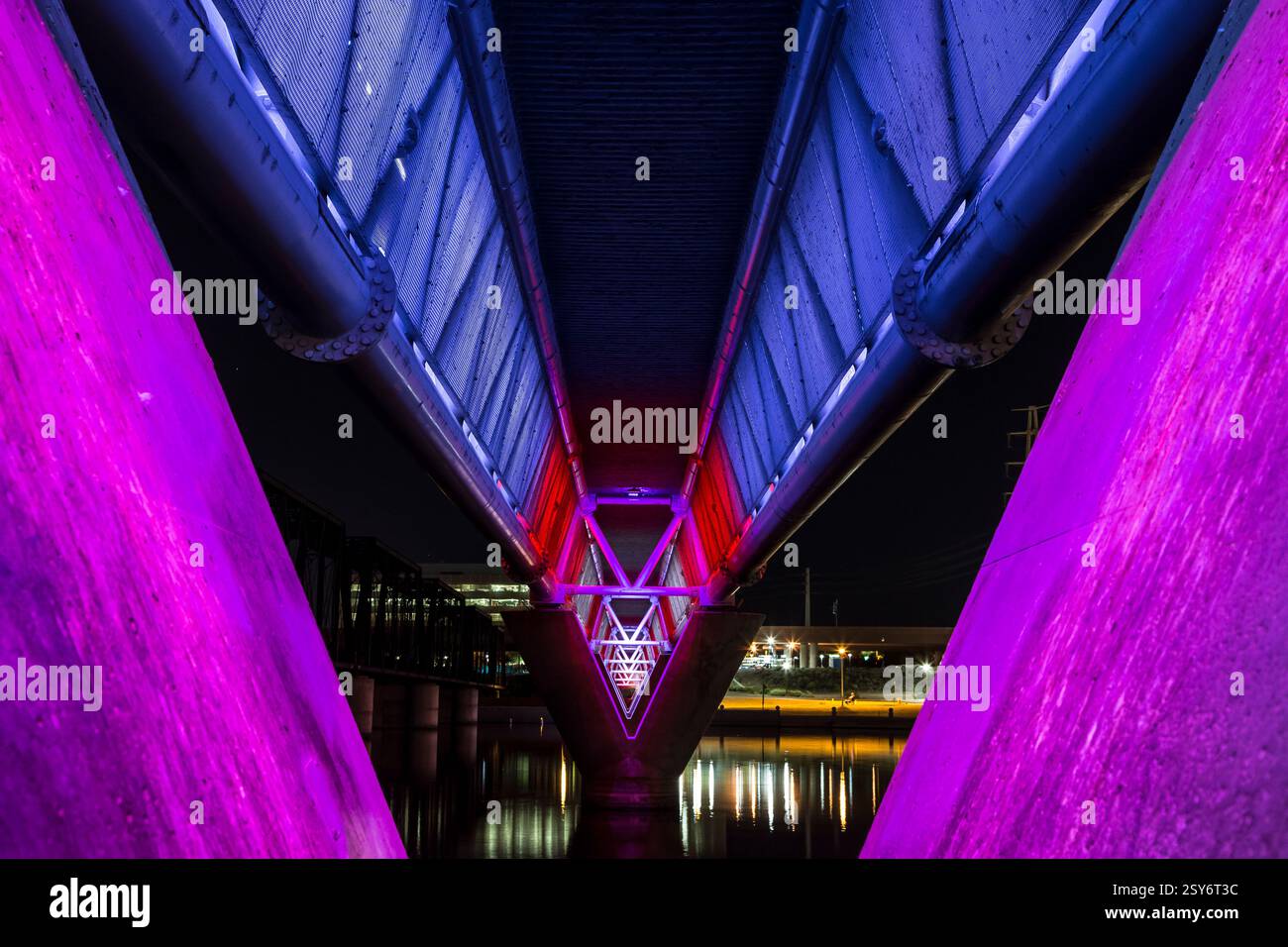 Bridge with a purple and blue lighted design. The bridge is lit up at ...