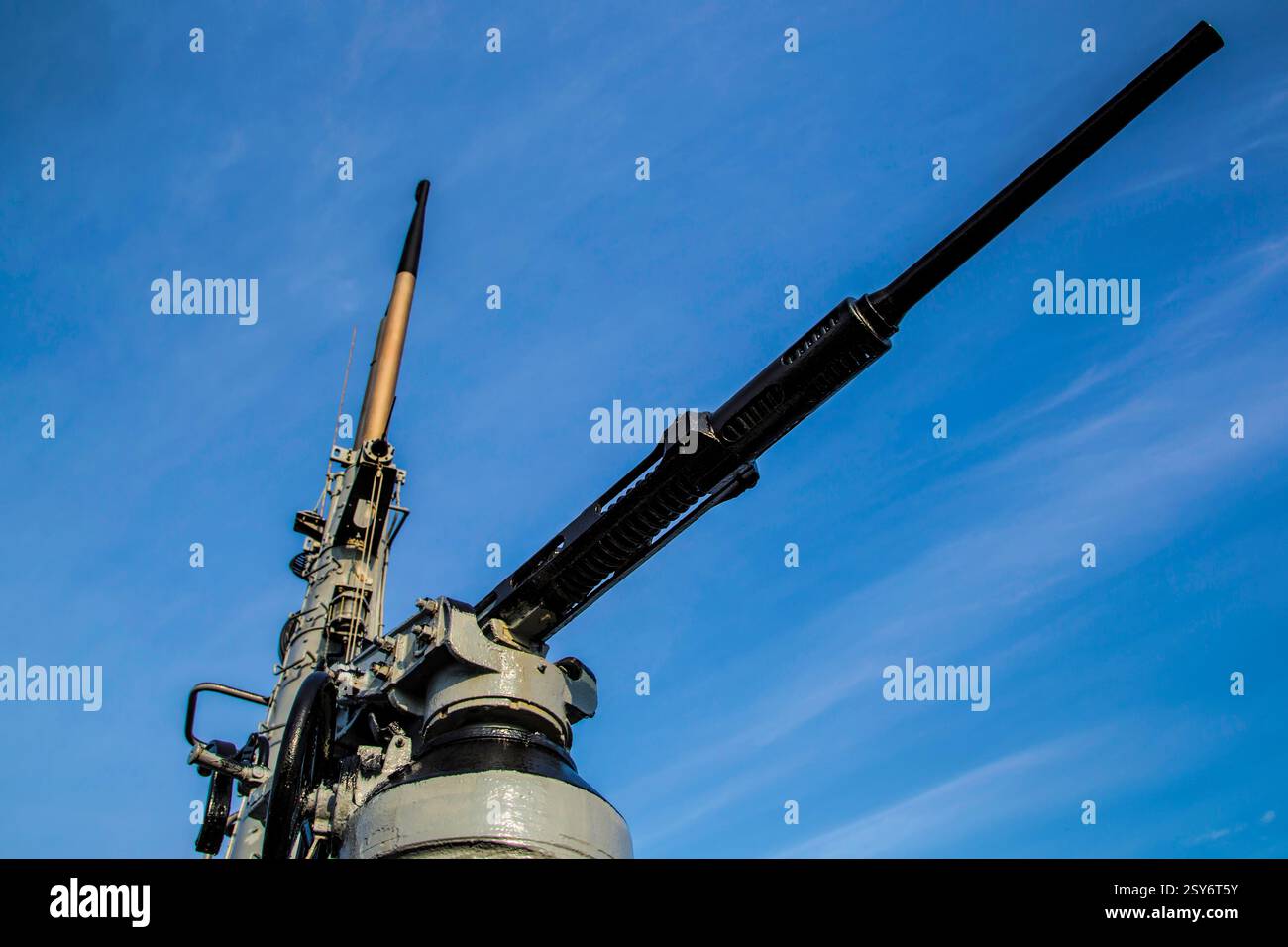 Large gun is on display in the sky. The gun is black and silver. The ...