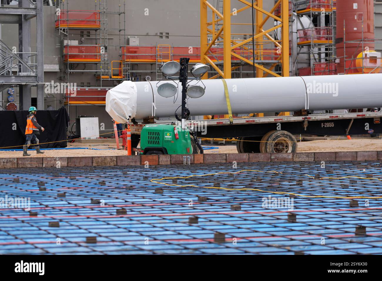 The foundation for a warehouse is visible in the foreground at Entergy ...