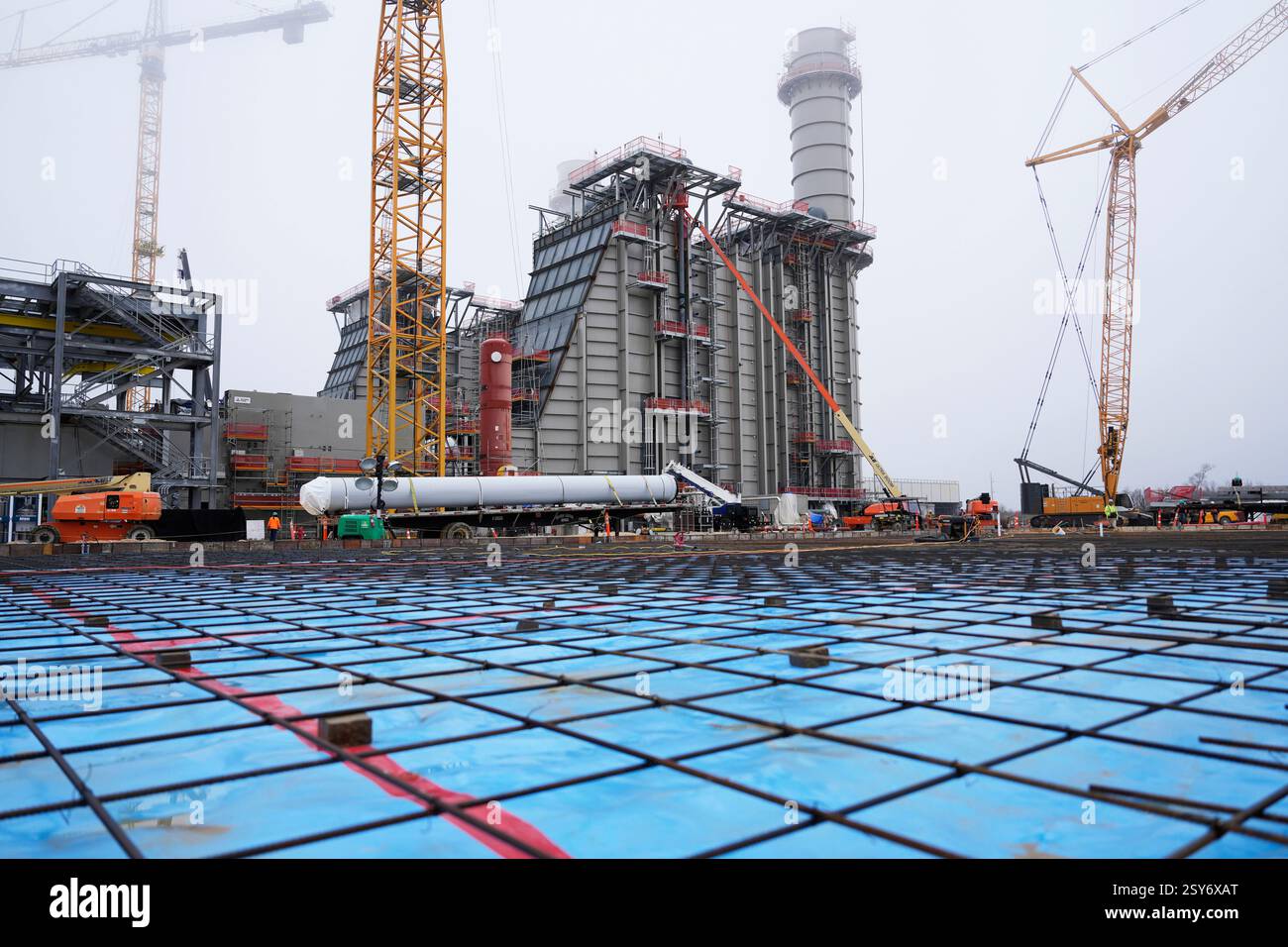 The foundation for a warehouse is visible in the foreground at Entergy ...