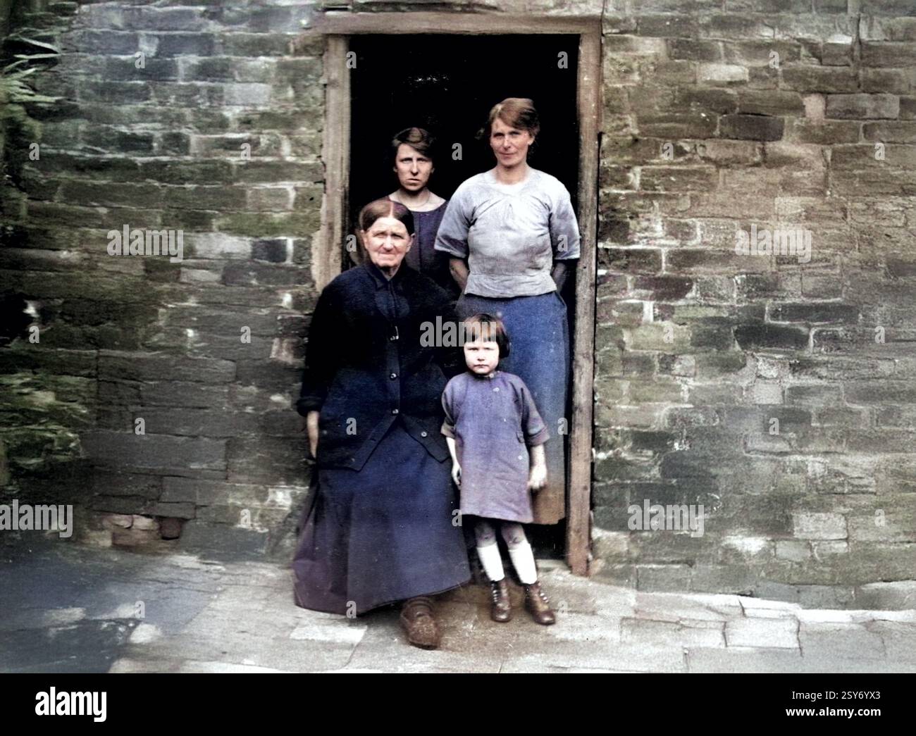 Poor working class women mother, daughters and grand daughter in slum ...