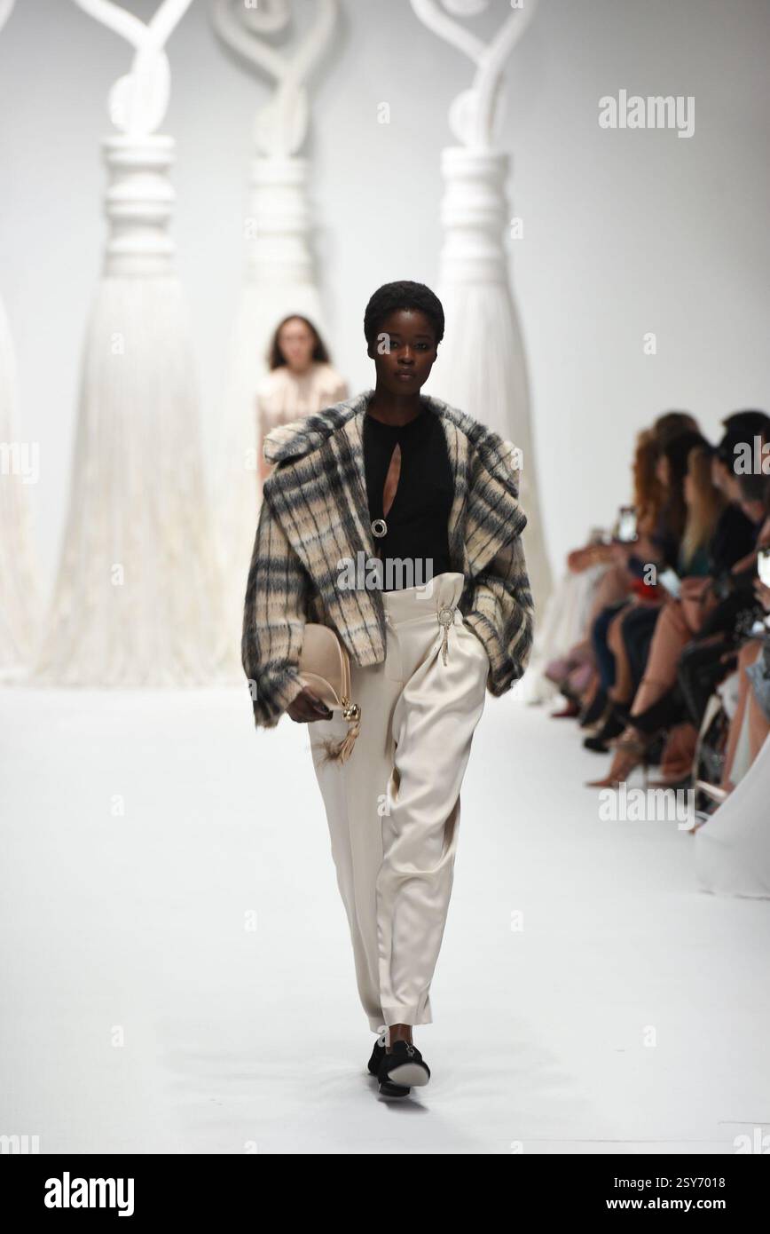 Milan, Italy. 27th Feb, 2025. Models walks the runway at the Genny ...