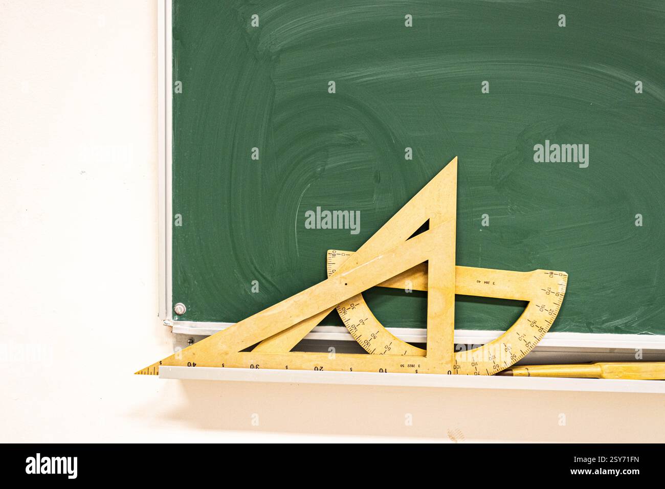 Wooden Rulers and Protractors on Green Chalkboard Stock Photo - Alamy