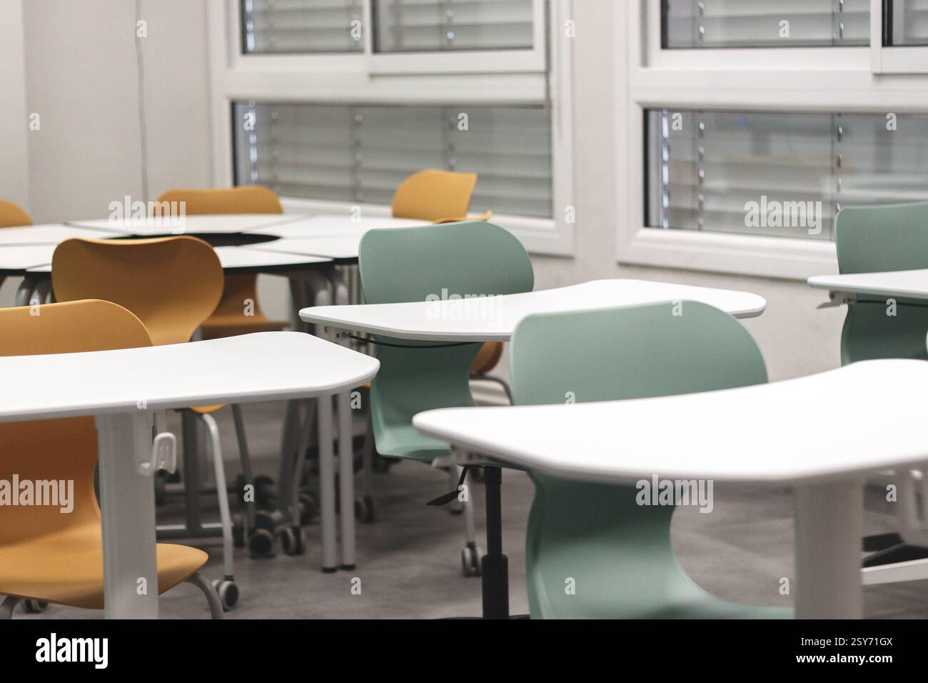 Modern Classroom with Colorful Chairs and Desks Stock Photo - Alamy