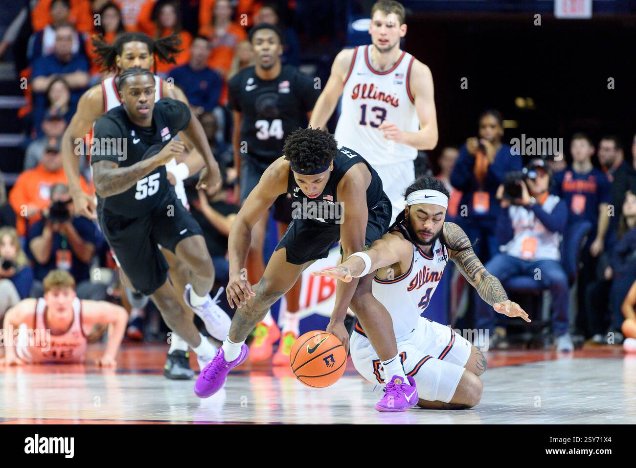 Michigan State's Jeremy Fears Jr. and Illinois' Kylan Boswell scramble ...