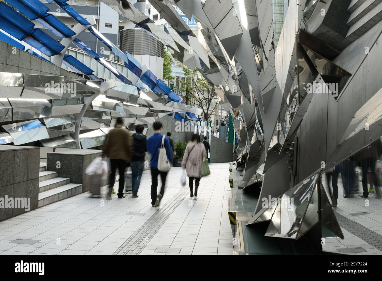 A modern art installation in Tokyo featuring reflective metal and ...