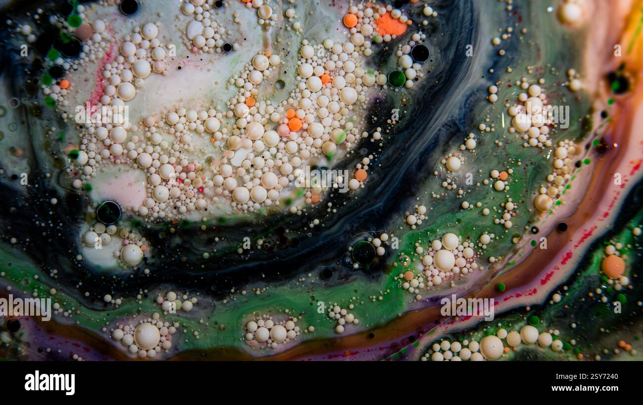 Abstract macro picture of paint mixed with oil to create an artistic ...