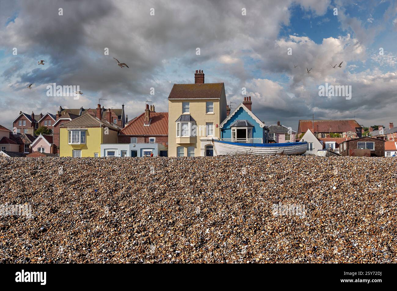Photo of Aldeburgh shigle beach and sea front with fising boats of the ...