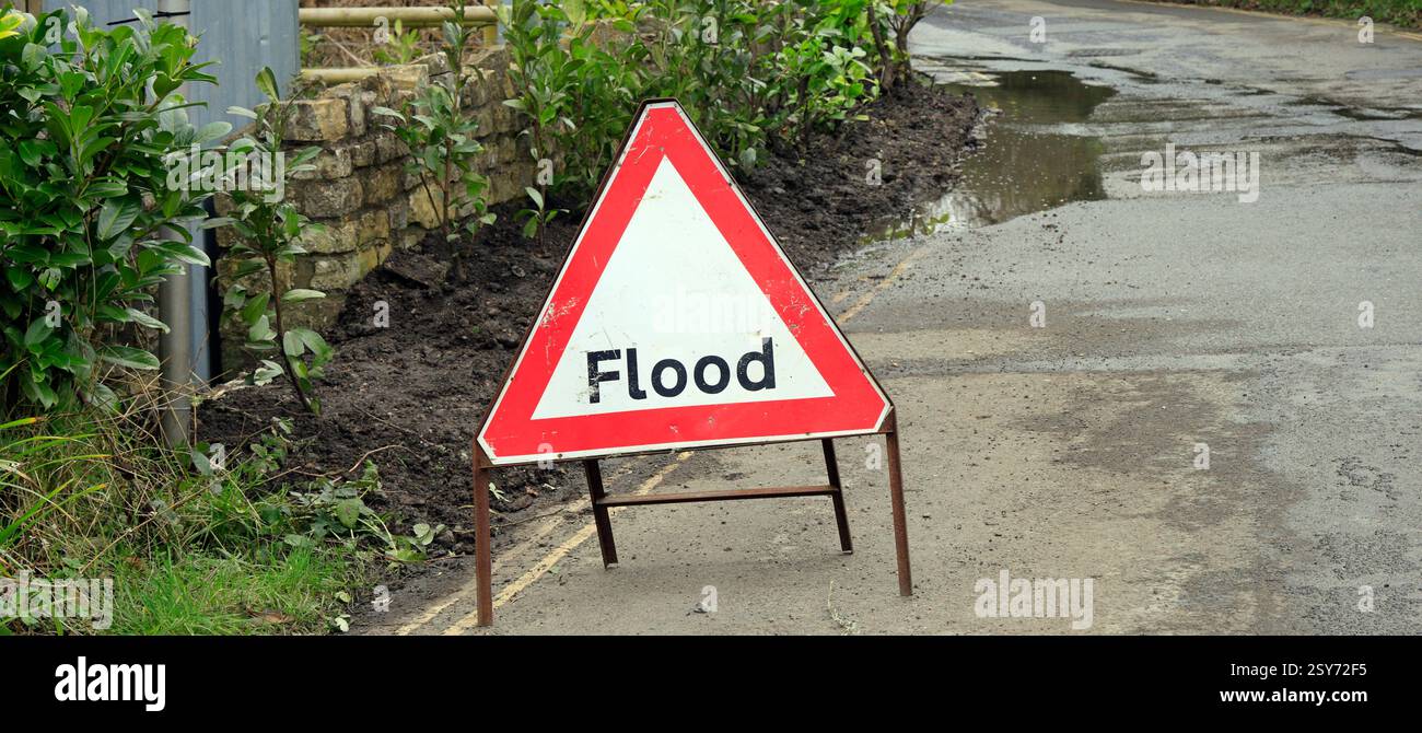 Temporary triangle flood warning sign, Saltford, near Bristol, England ...