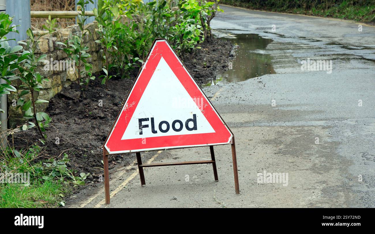 Temporary triangle flood warning sign, Saltford, near Bristol, England ...