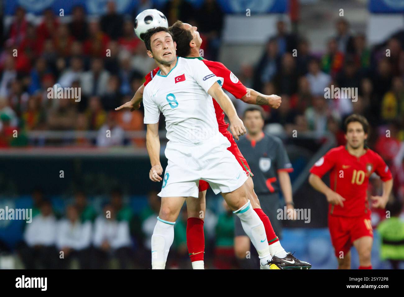 Nihat Kahveci of Turkey (8) jumps for a header against of Petit of ...