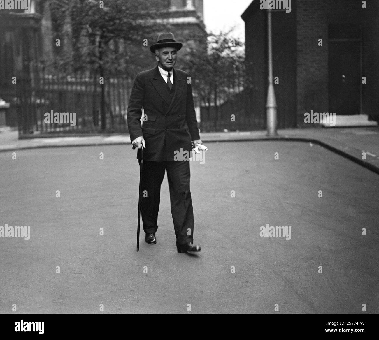 Sir John Simon arriving at Downing Street, London for the cabinet ...