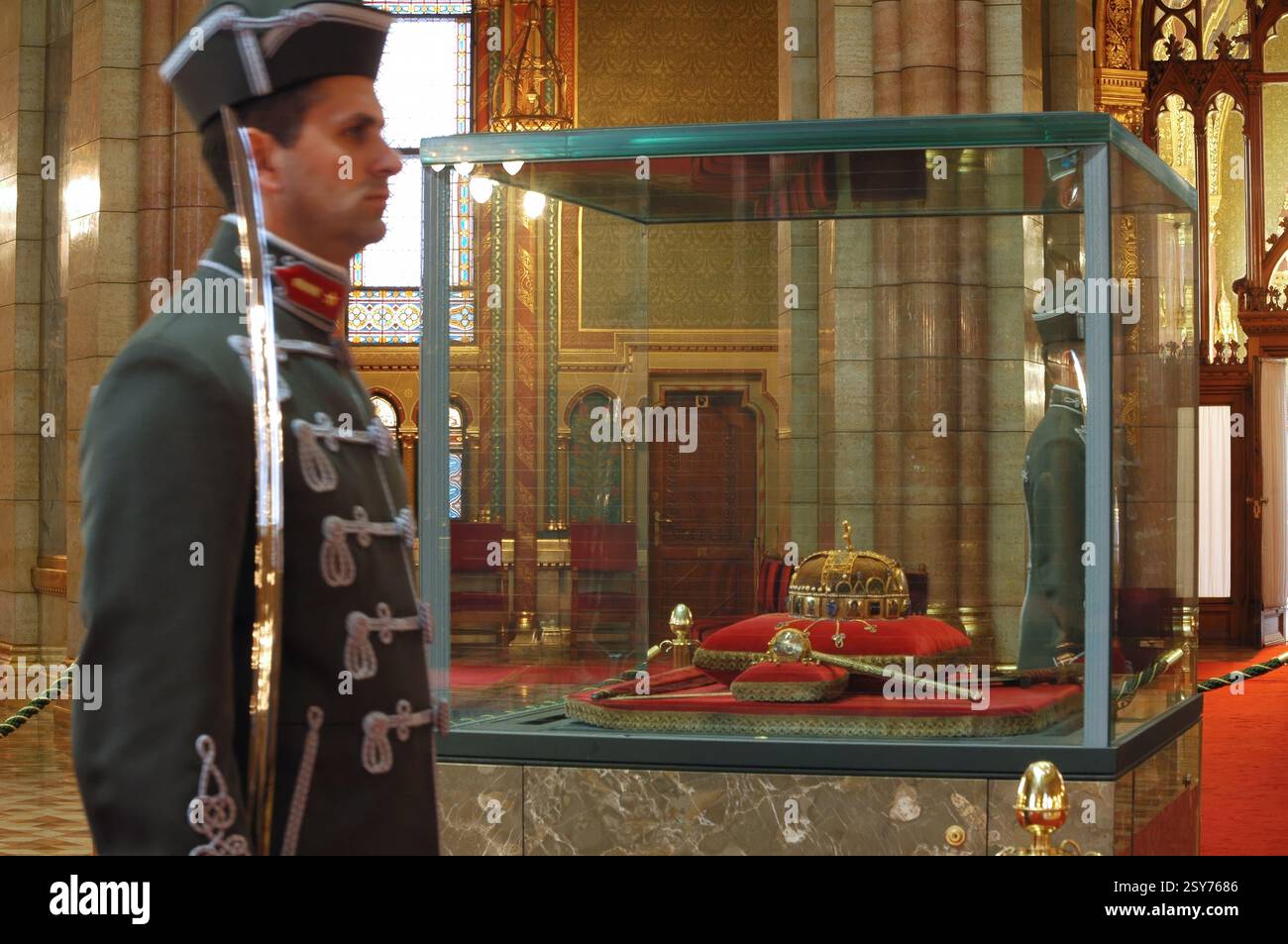 Guardsman stands guard next to the Holy Crown of Hungary, also known as ...