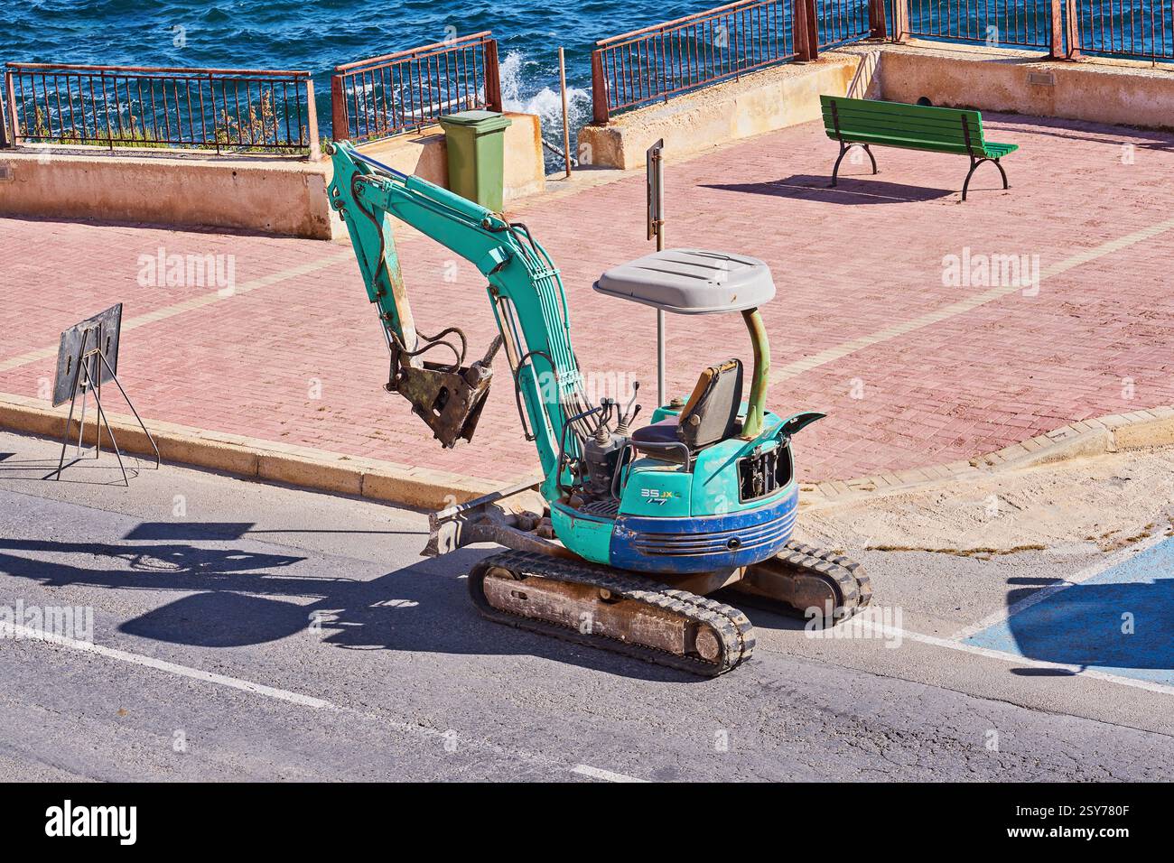 Mini Excavator Digging for Palm Tree Planting in Urban Landscape Stock ...