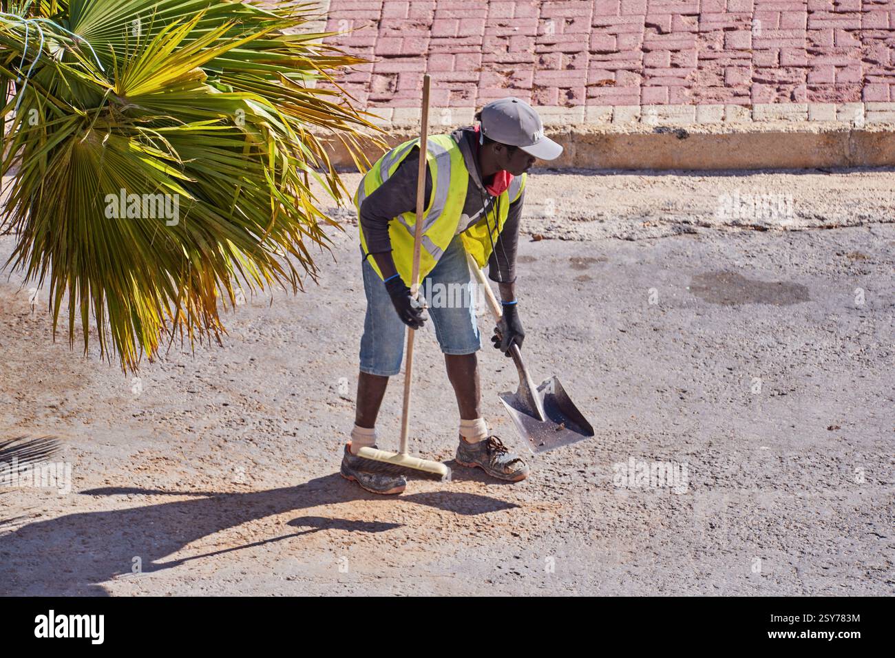Street Workers Cleaning Up After Landscaping Work Stock Photo - Alamy