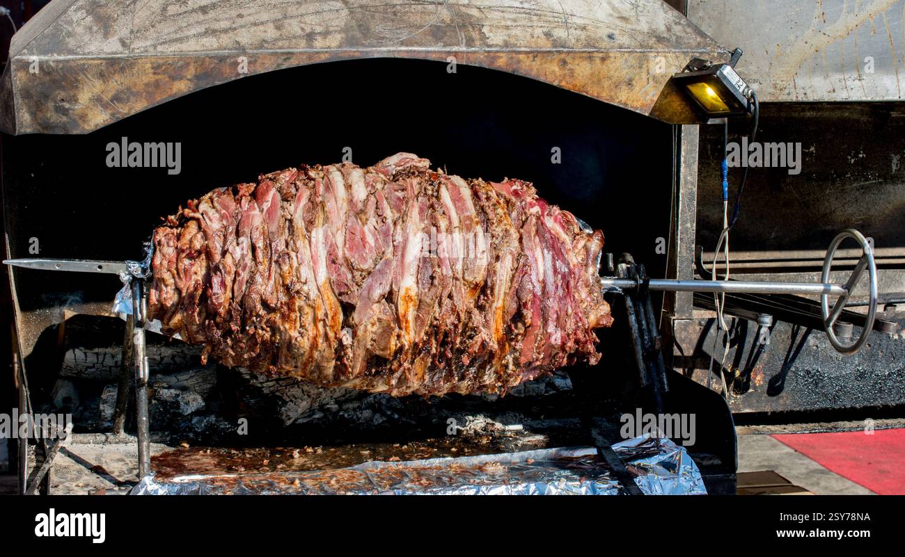 Turkish cag Kebab on pole in horizontal position Stock Photo - Alamy