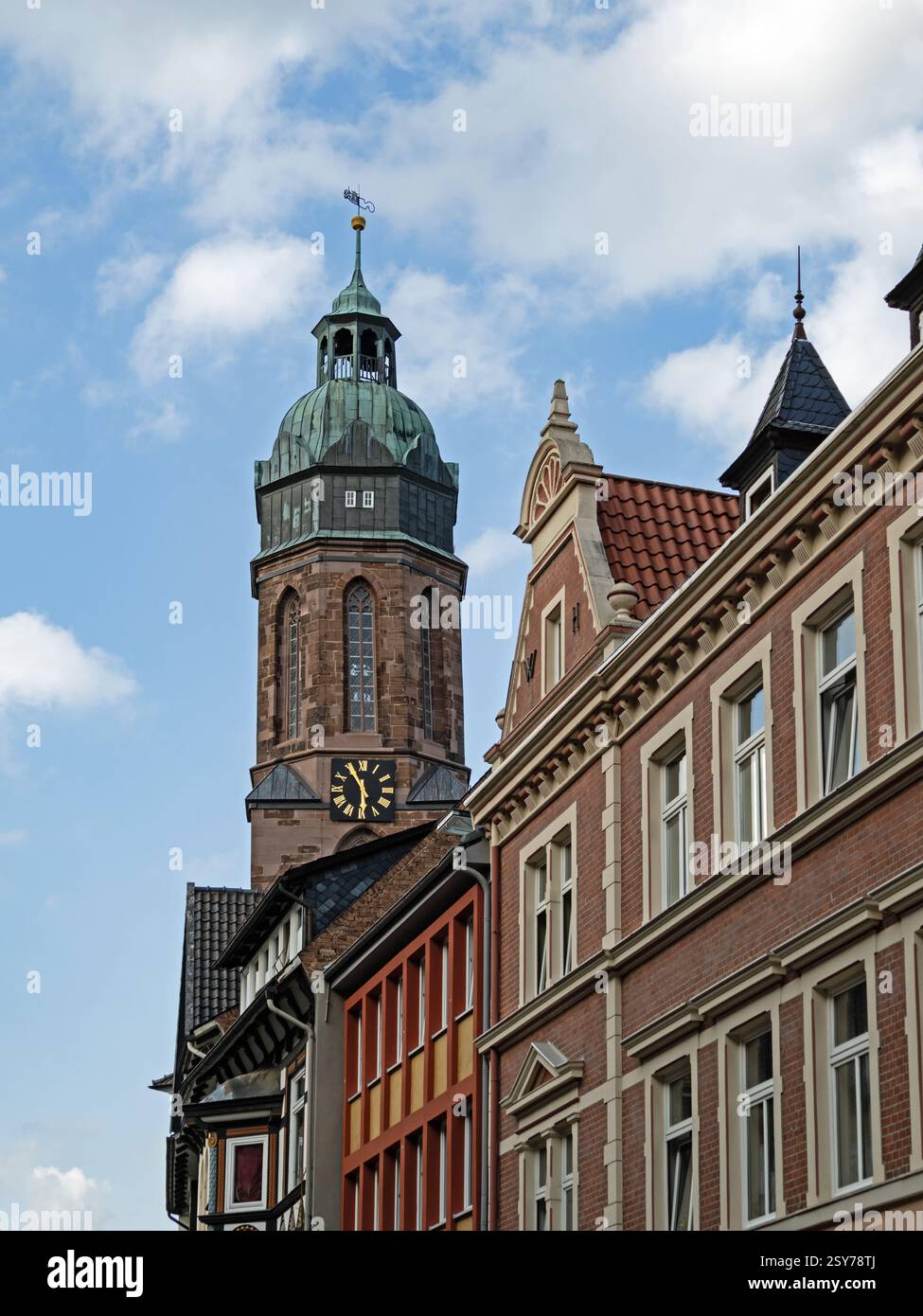 Exterior view of St. Jacob's Church and facades of historic houses in ...