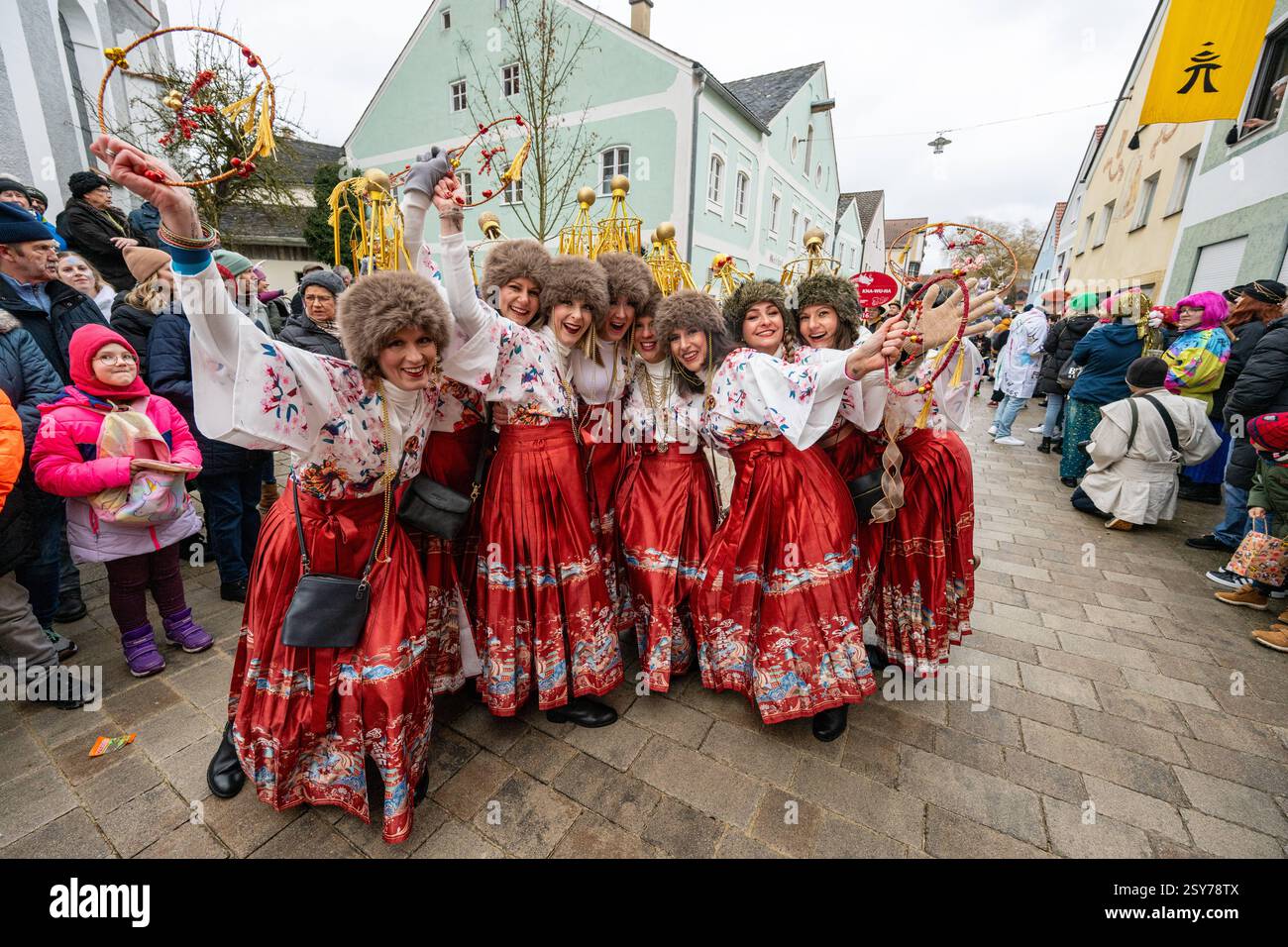 27 February 2025, Bavaria, Dietfurt: A group in Chinese costumes takes ...