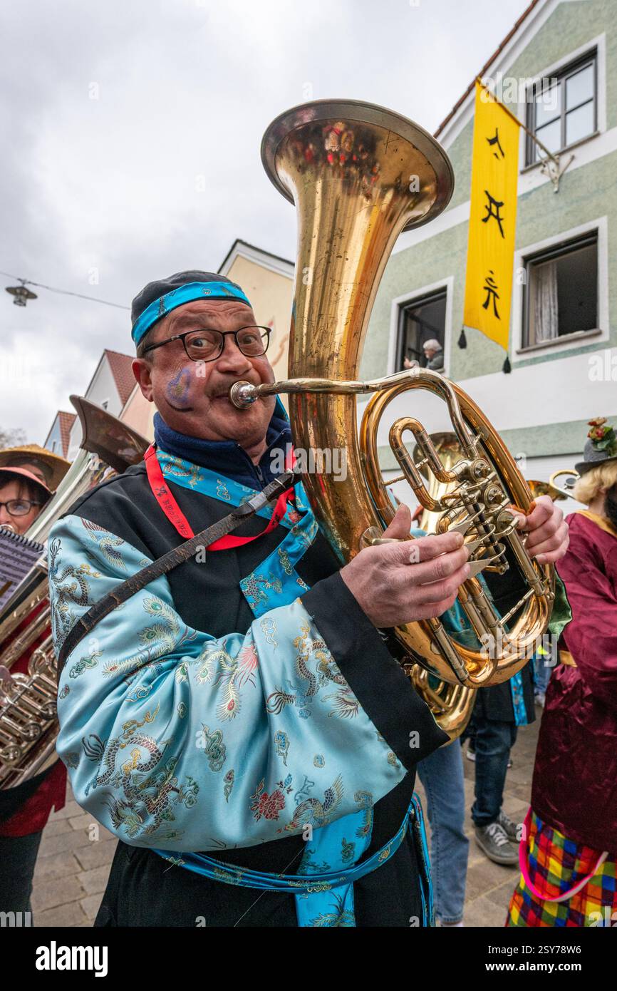 27 February 2025, Bavaria, Dietfurt: A musician in Chinese costume ...