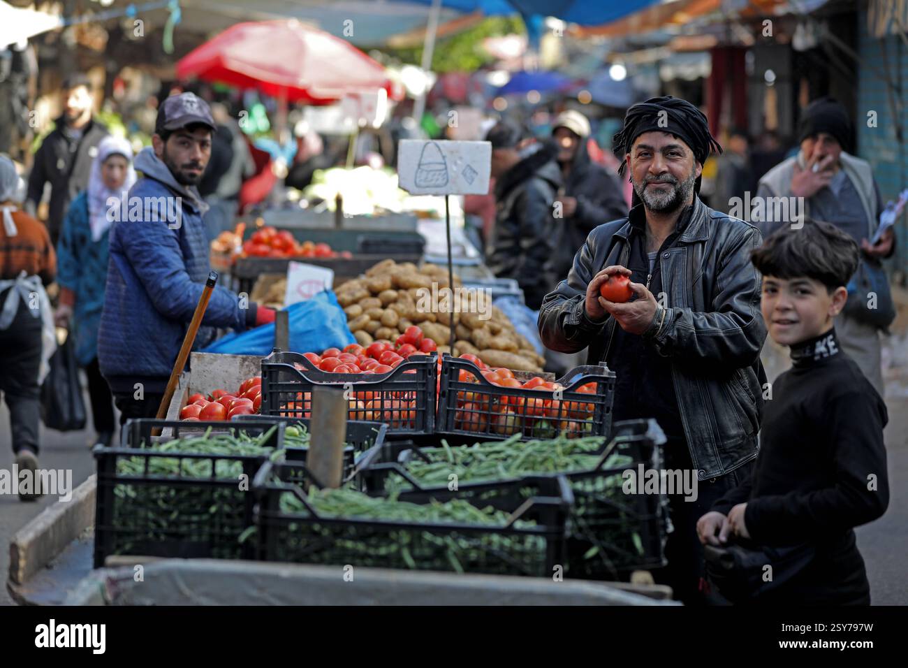 Beirut, Lebanon. 27th Feb, 2025. A vegetable seller prepares for ...