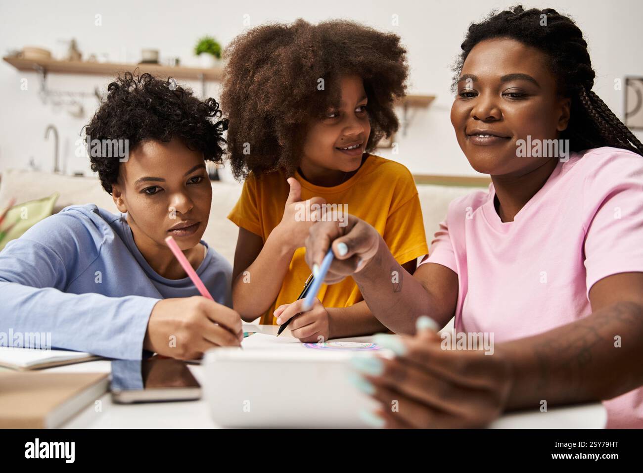 Three family members enjoy creative time while bonding and sharing ...