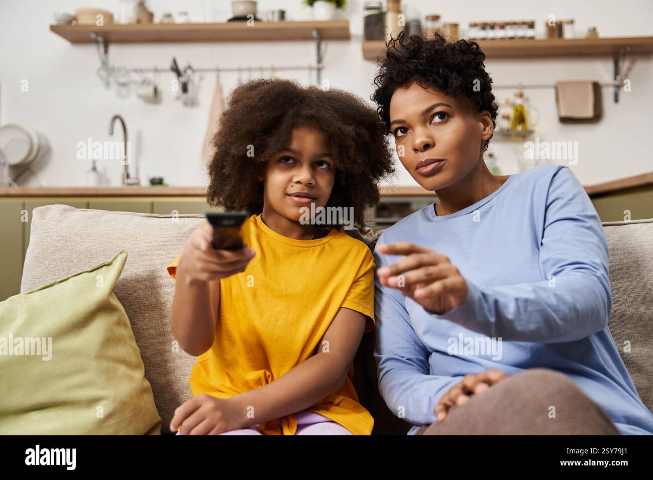 A young family shares a joyful experience while watching their favorite ...
