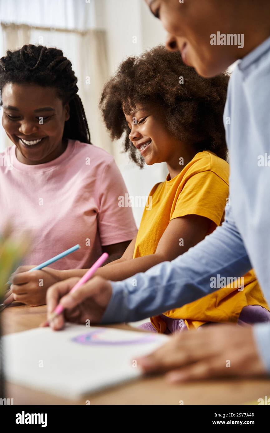 A lovely moment of a diverse family bonding over colorful drawings and ...